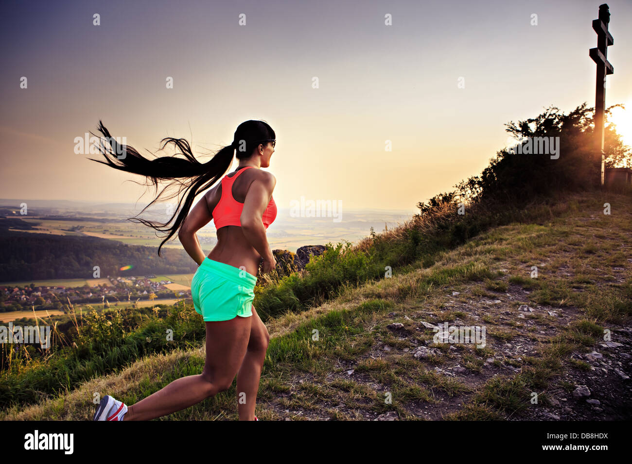 a young woman running in the mountains Stock Photo - Alamy