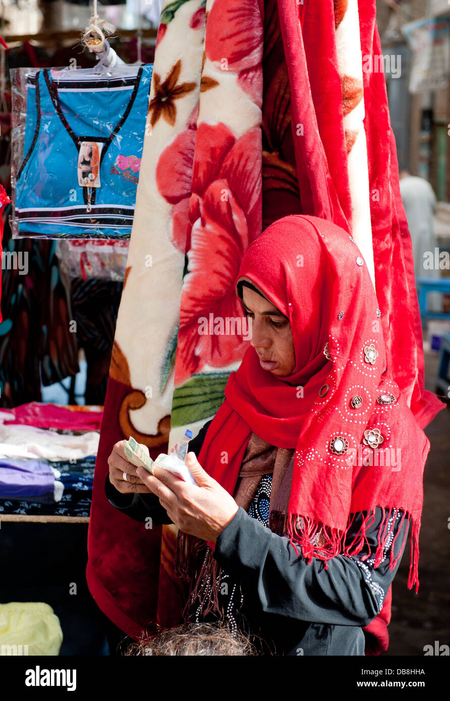 Poor woman counting money outside hi-res stock photography and images ...