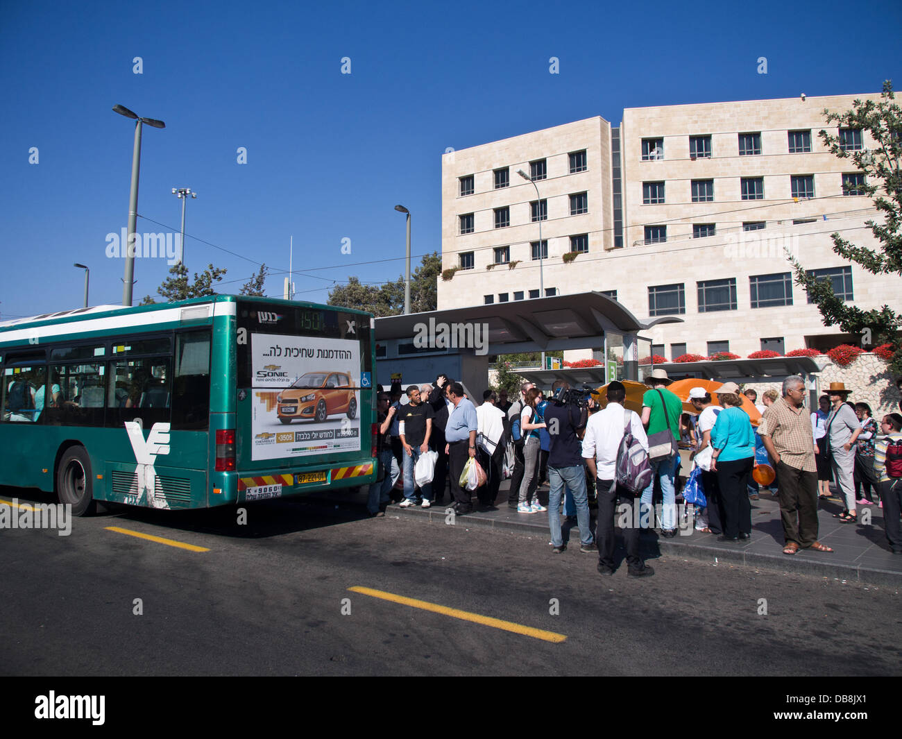Jerusalem, Israel. 25-July-2013. A bus stops to pick up passengers at a ...