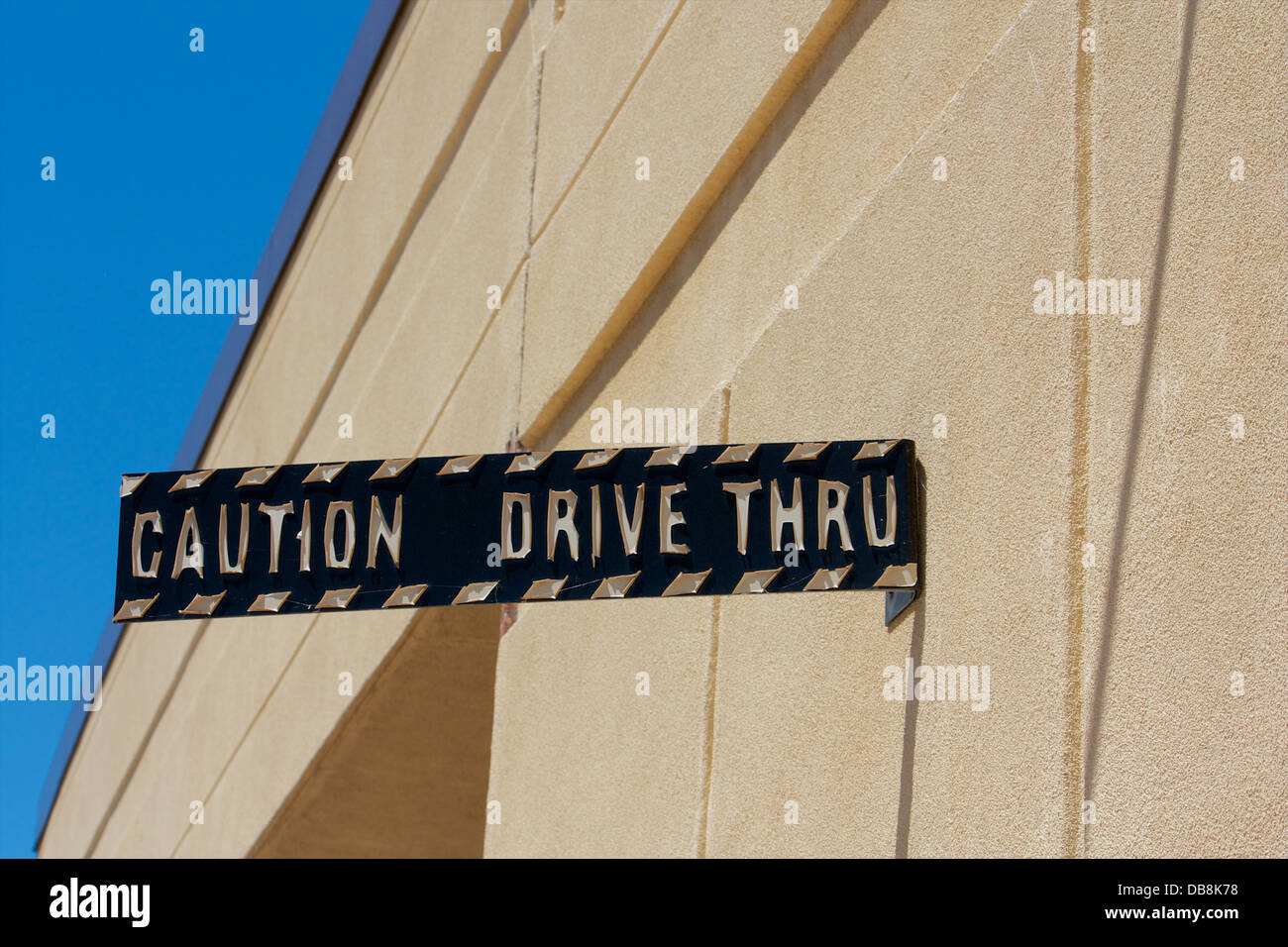 Caution drive thru sign Stock Photo - Alamy