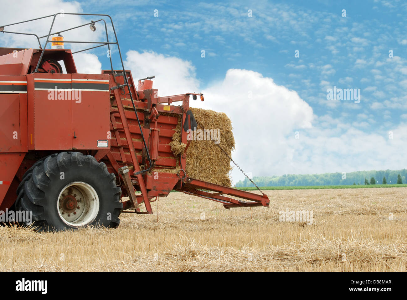 Field of cut hay and baler hi-res stock photography and images - Alamy