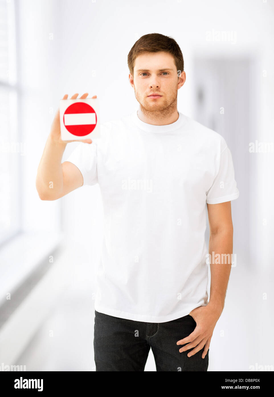 young man showing no entry sign Stock Photo - Alamy