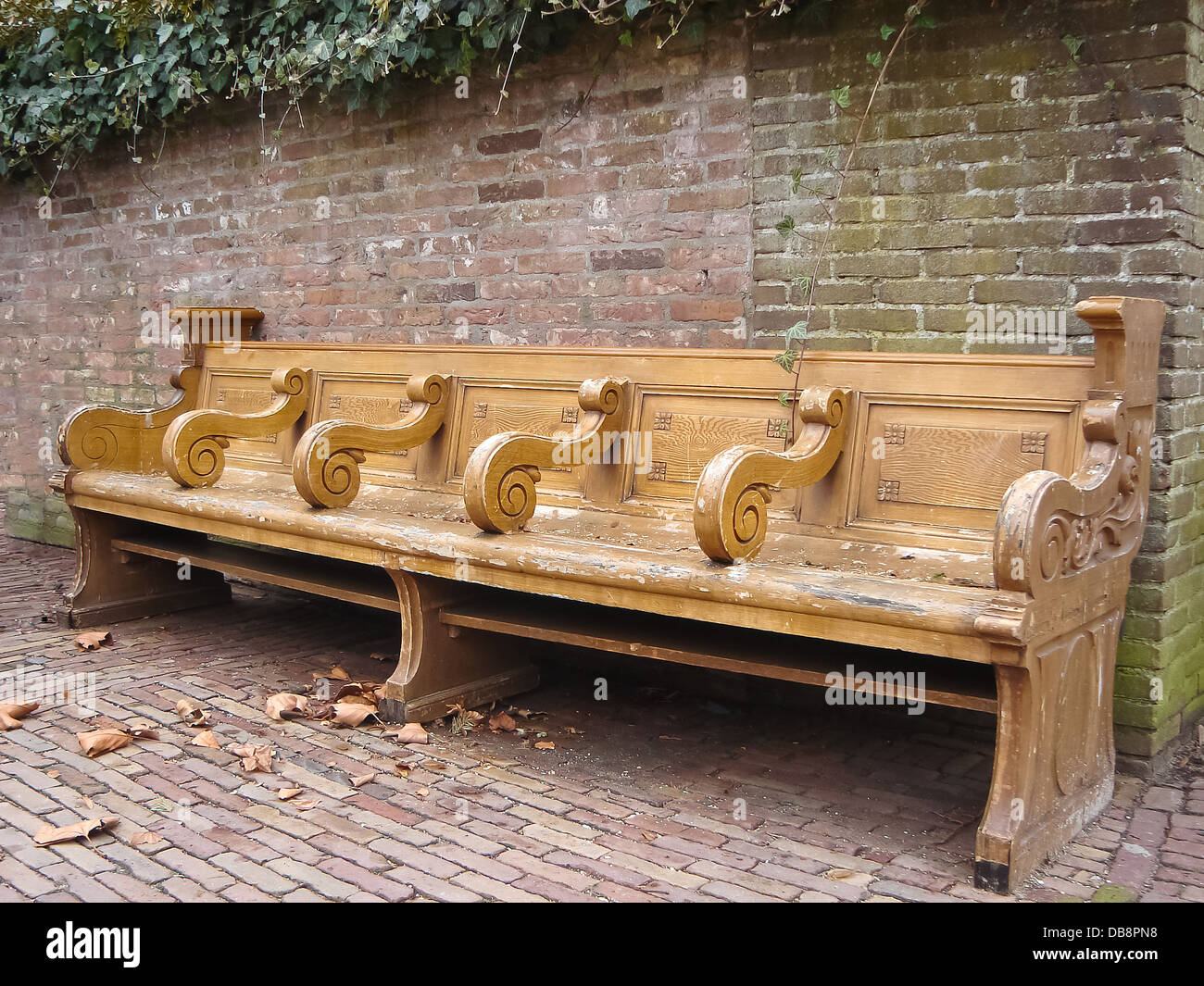 Old bench in city park Stock Photo - Alamy