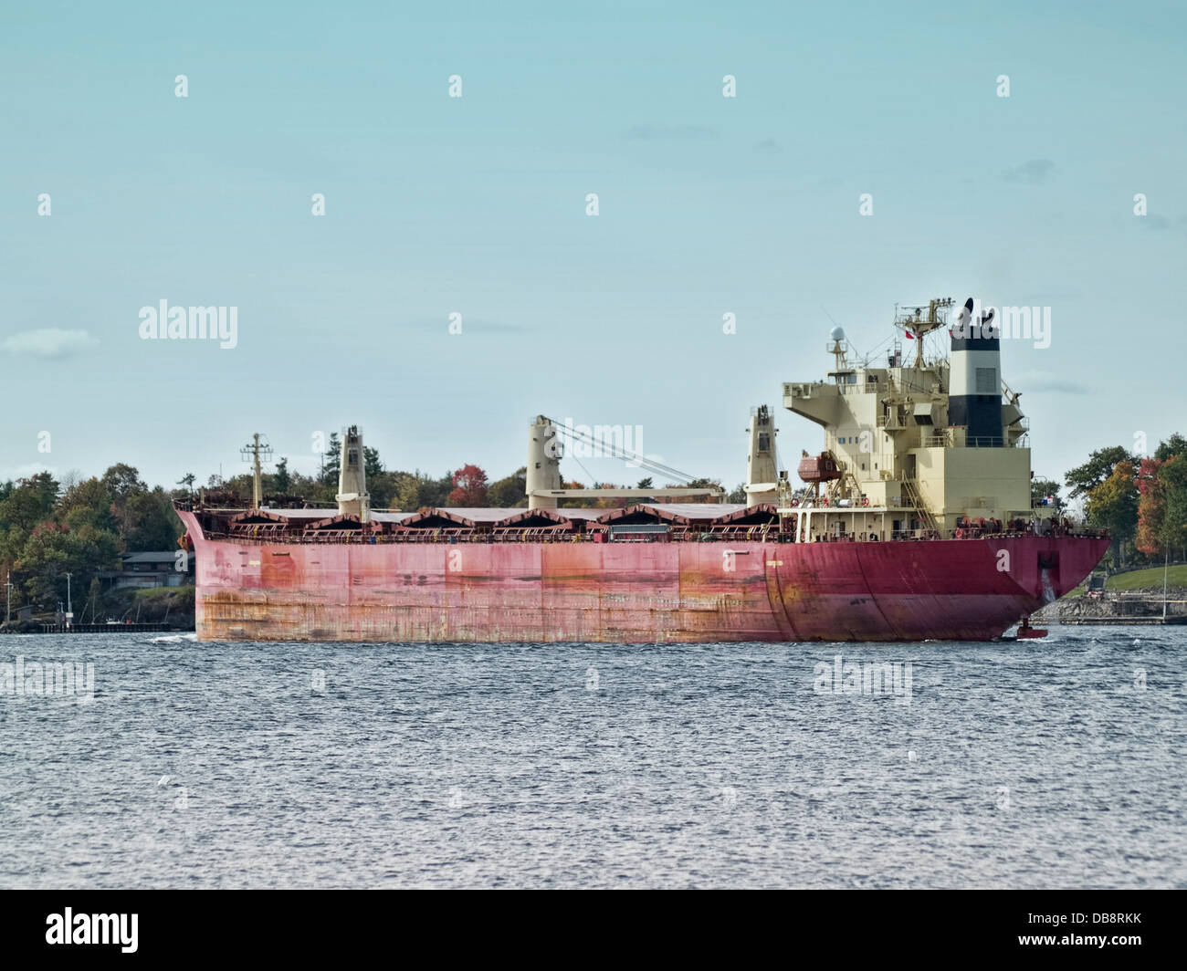 overseas shipping boat sailing through the thousand islands waterways ...