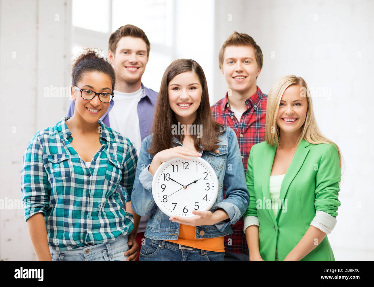 group of students at school with clock Stock Photo - Alamy