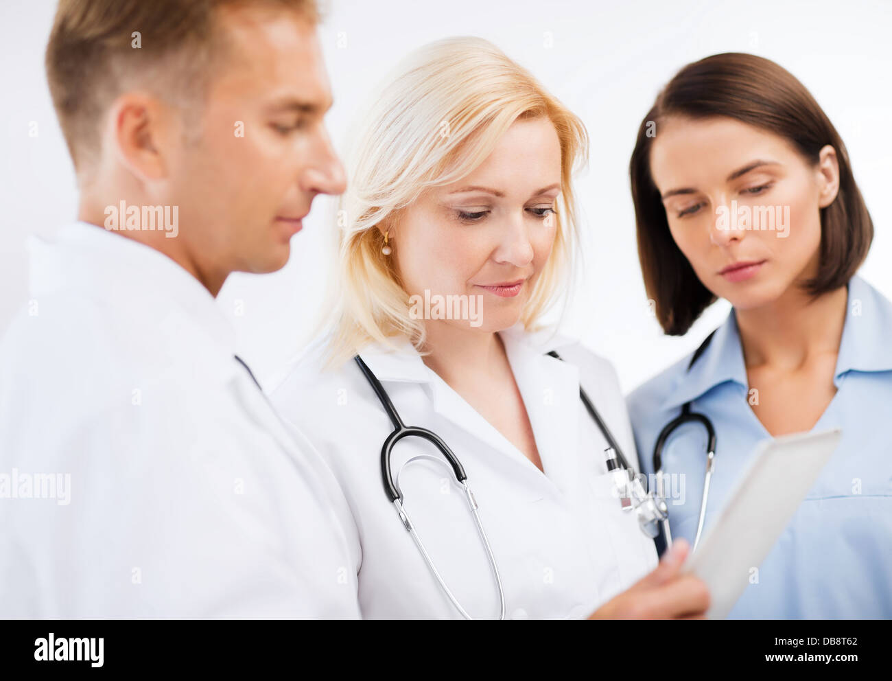 doctors looking at tablet pc Stock Photo - Alamy