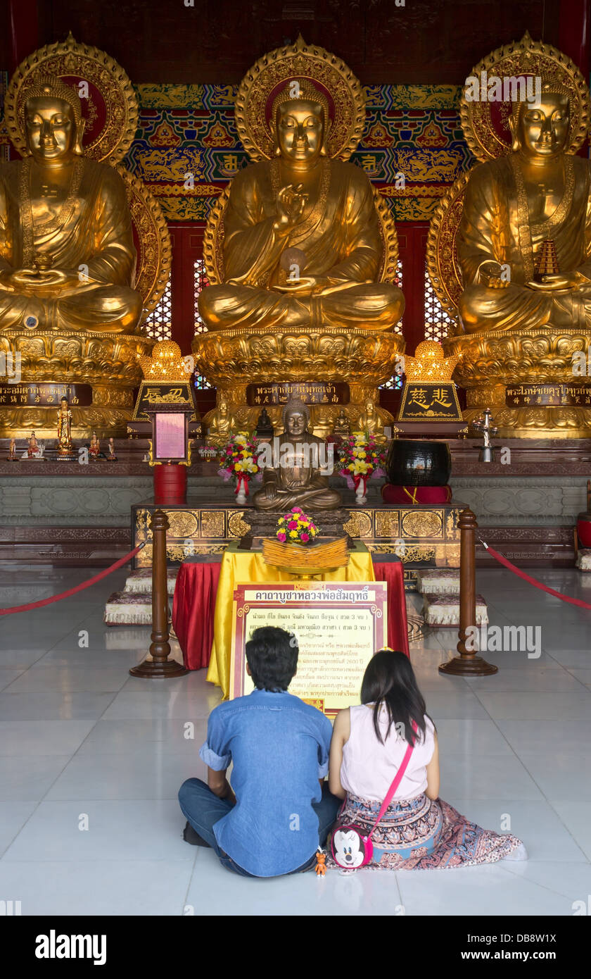 a pair of praying Buddha Stock Photo - Alamy