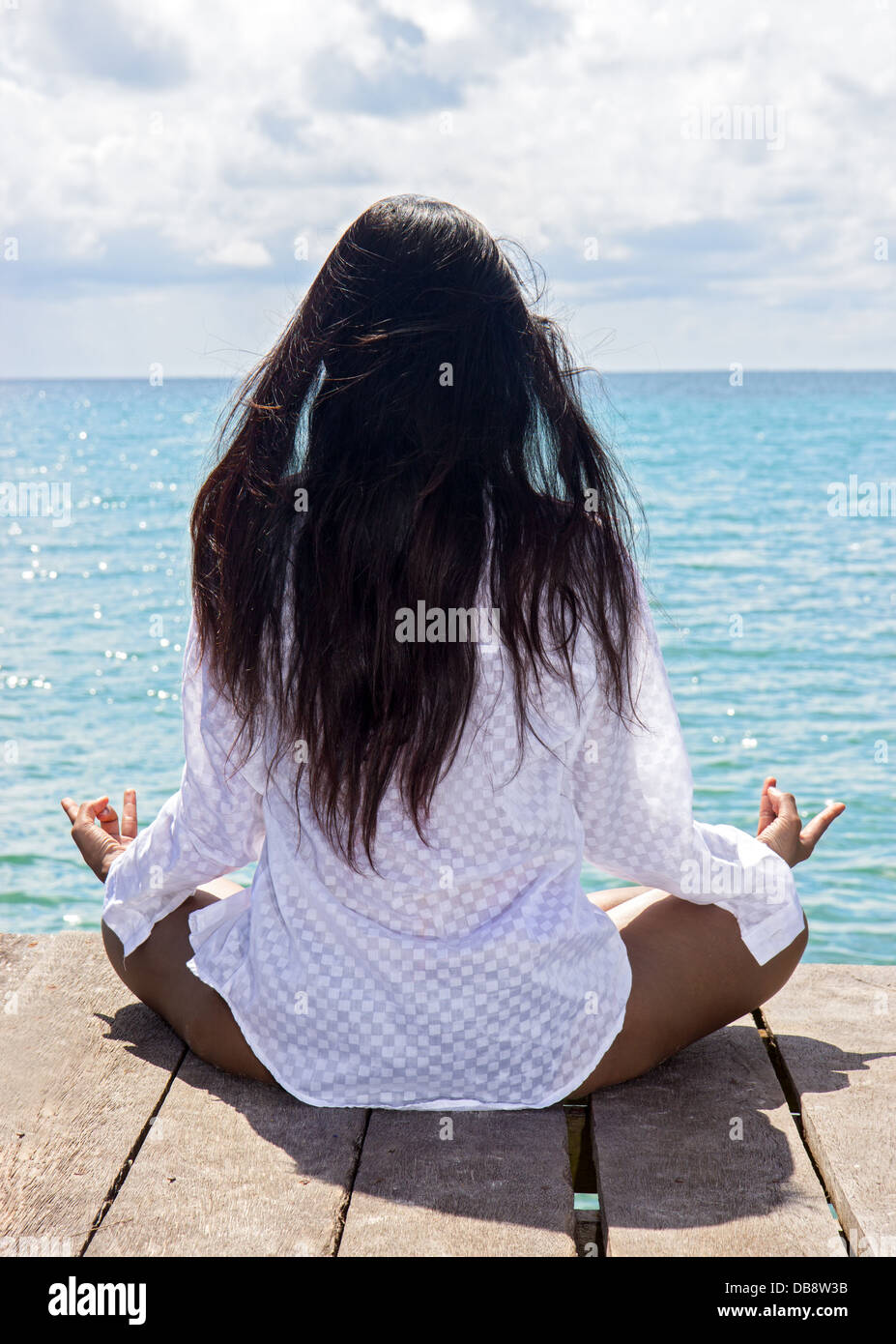woman meditating on the sea Stock Photo - Alamy