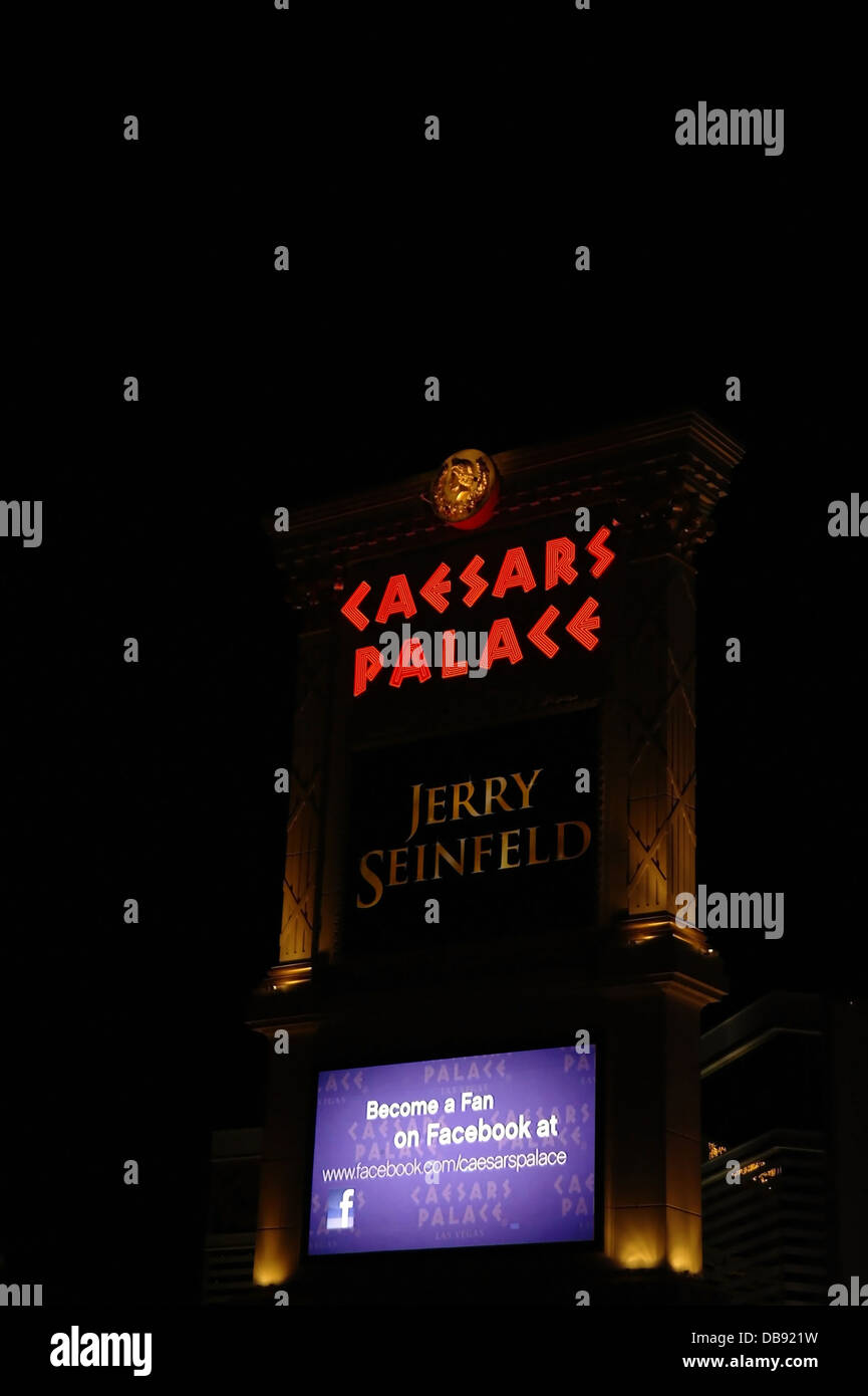 Night portrait tall illuminated brown masonry red neon Caesar's Palace ...