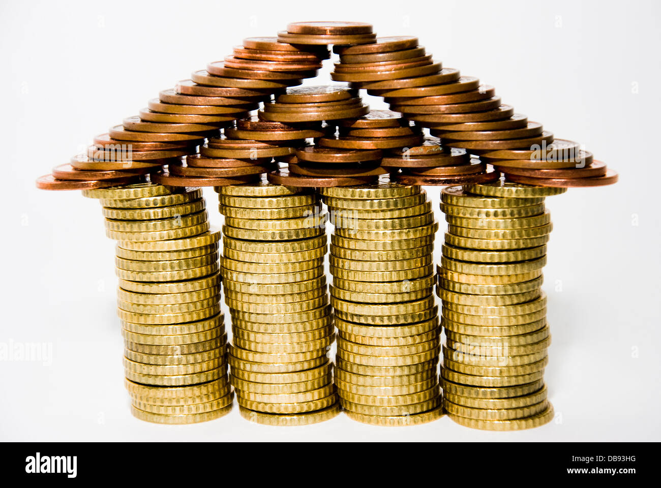 house made with euro coins on white background Stock Photo - Alamy