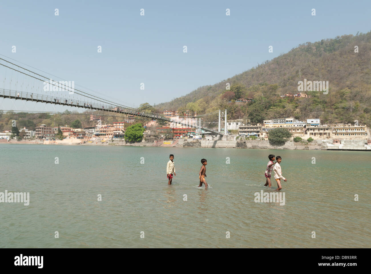 Rishikesh, India. Indian boys play in the river Ganges, Rishikesh ...