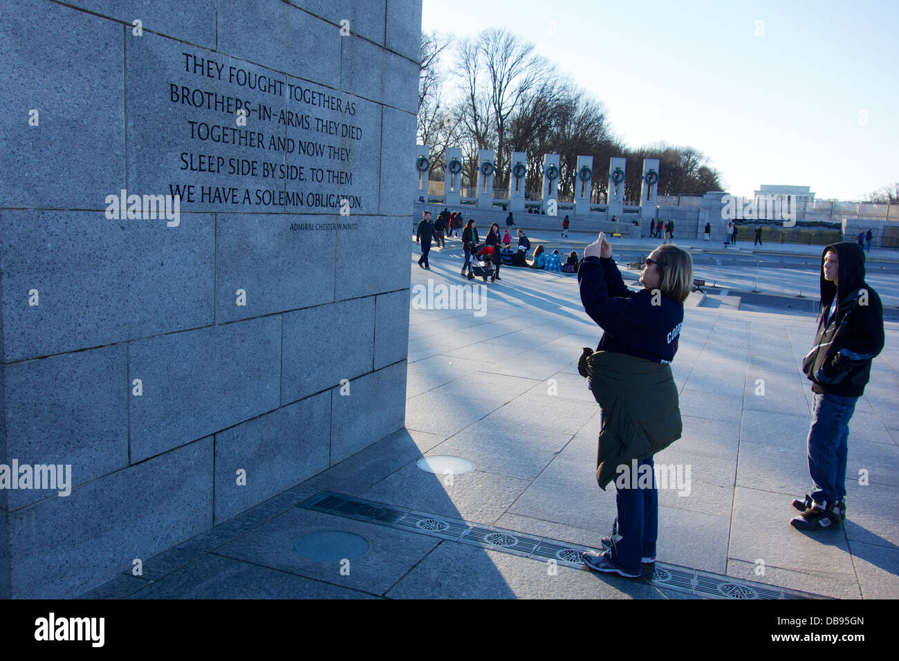 Woman photographing Admiral Nimitz quote. World War II Memorial ...