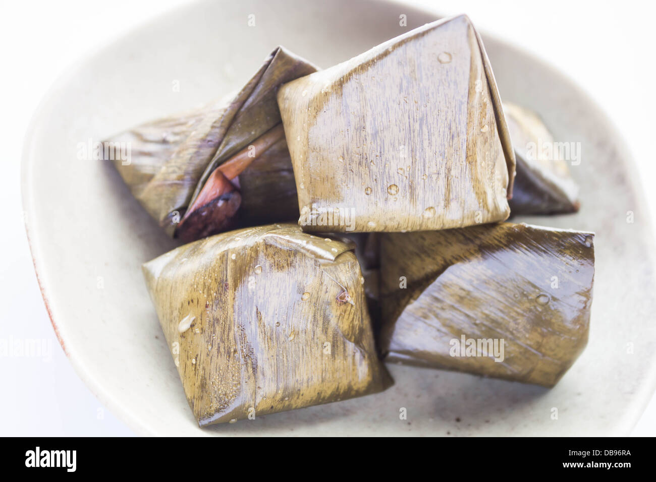 Stuffed dough pyramid dessert on plate up close, stock photo Stock ...