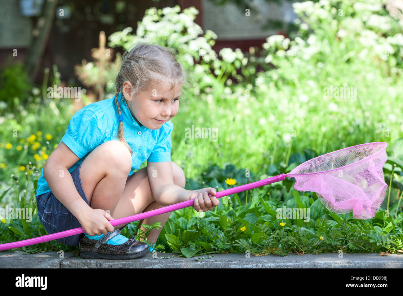 Girl catching butterfly hi-res stock photography and images - Alamy