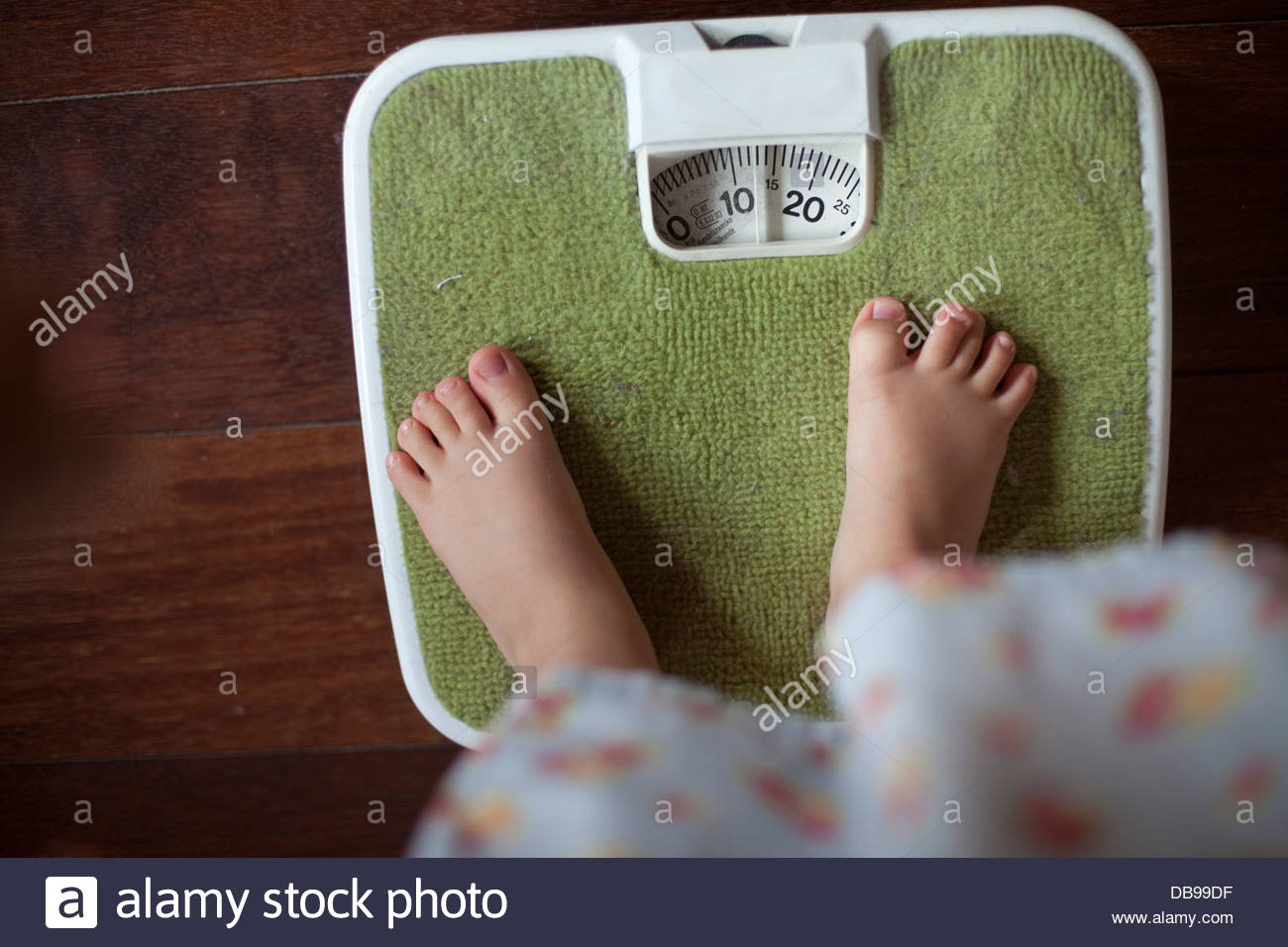 Weighing Machine Child Stock Photos & Weighing Machine Child Stock ...