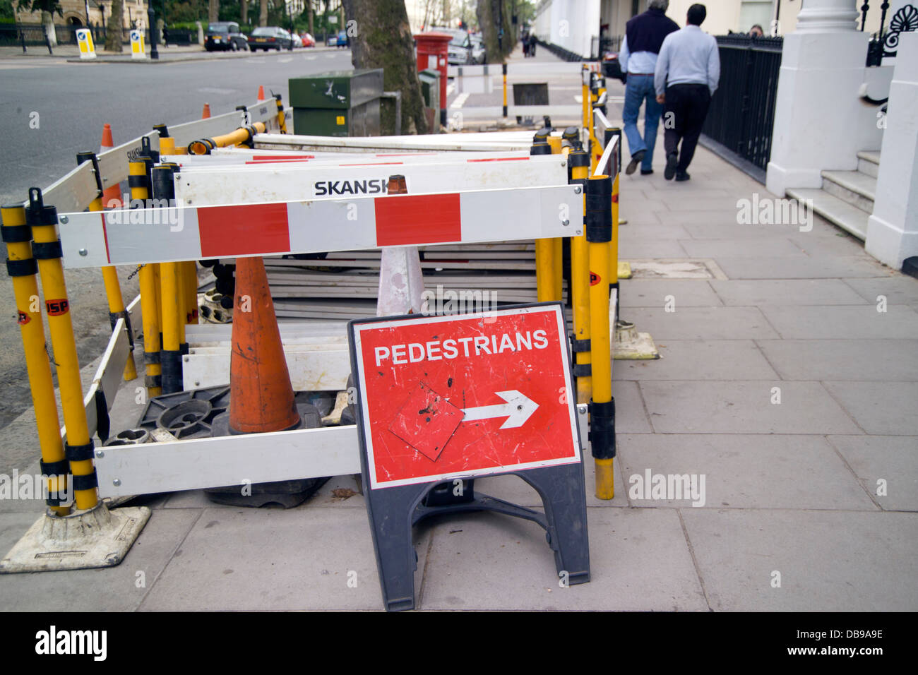 road works on footpath with pedestrian diversion sign London Kensington ...