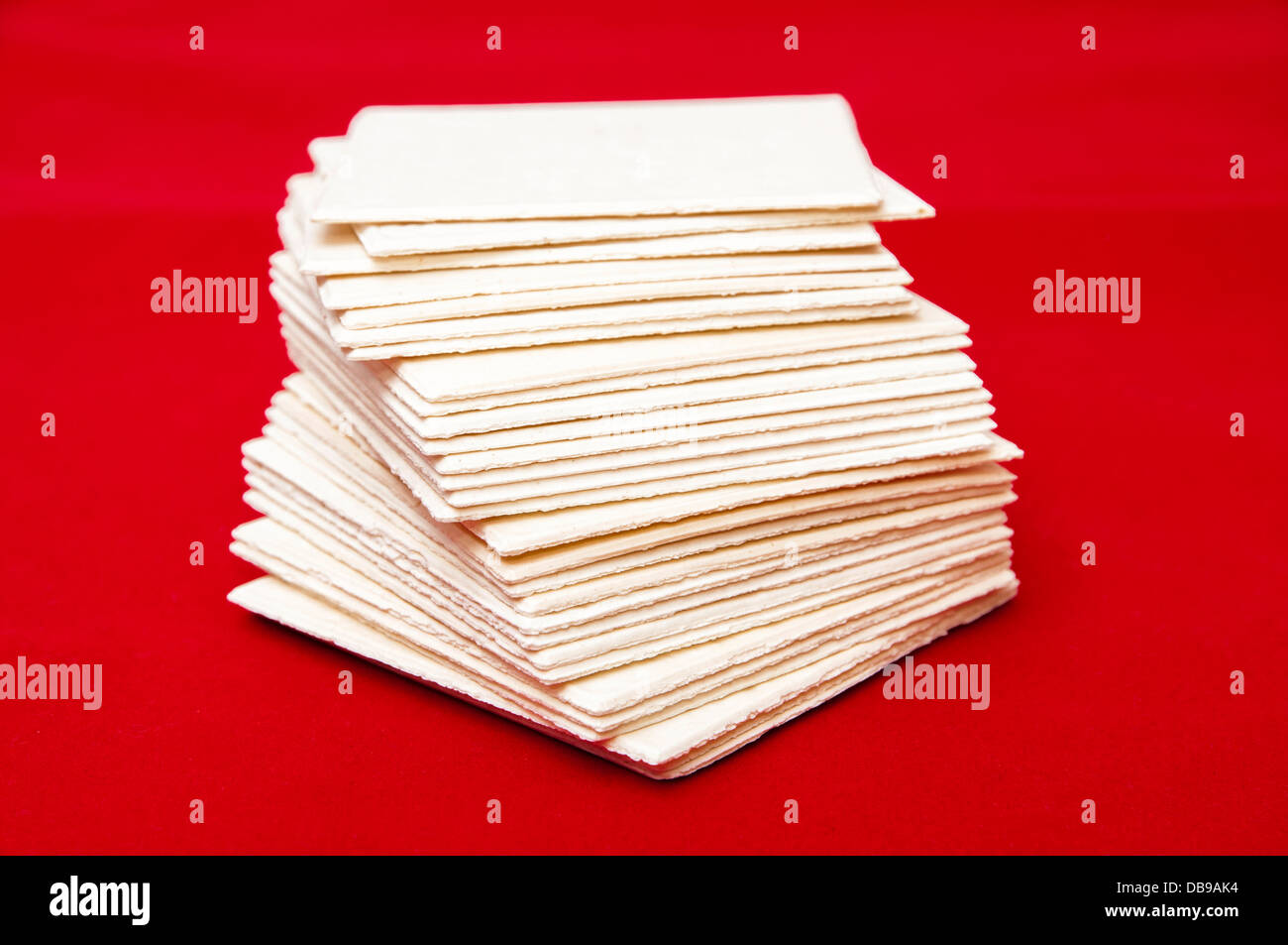 crackers on a red background Stock Photo - Alamy