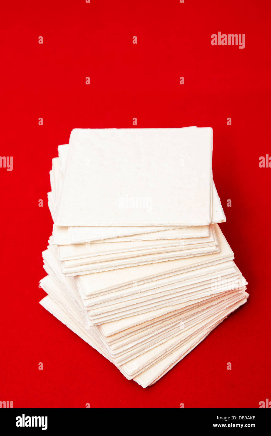 crackers on a red background Stock Photo - Alamy