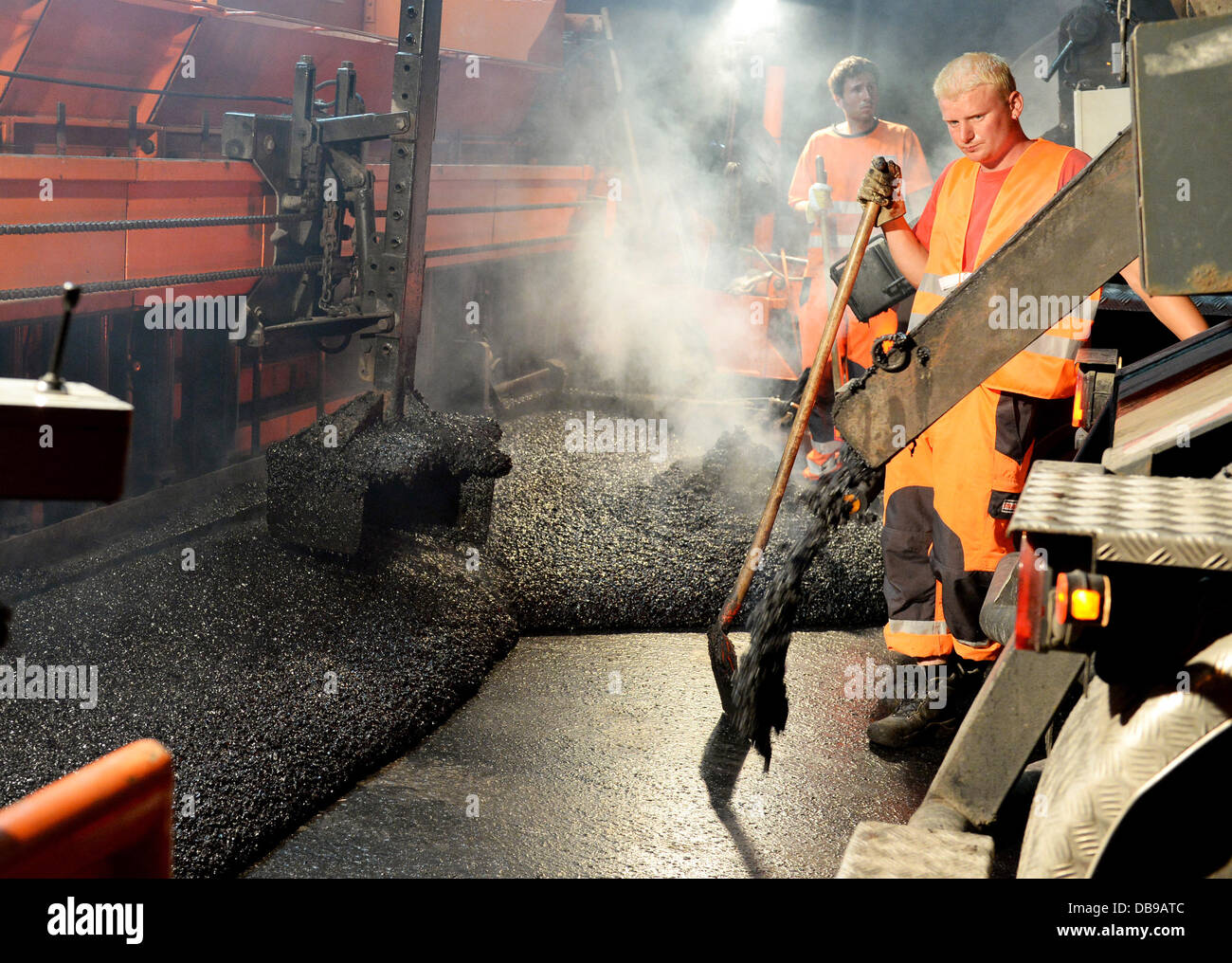 Construction workers build parts of the motorway A 100 during a full ...