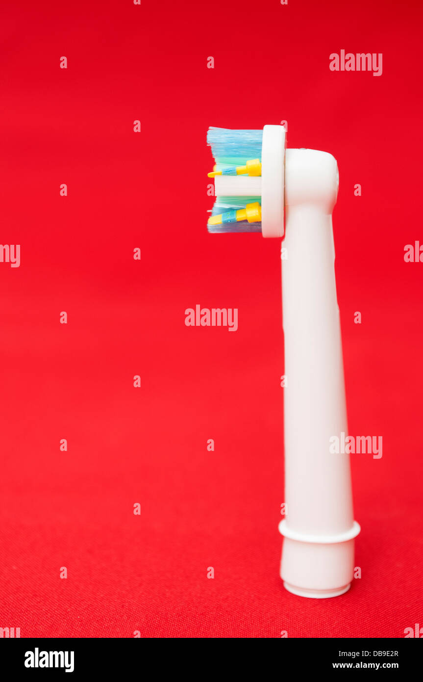 toothbrush on a red background Stock Photo - Alamy