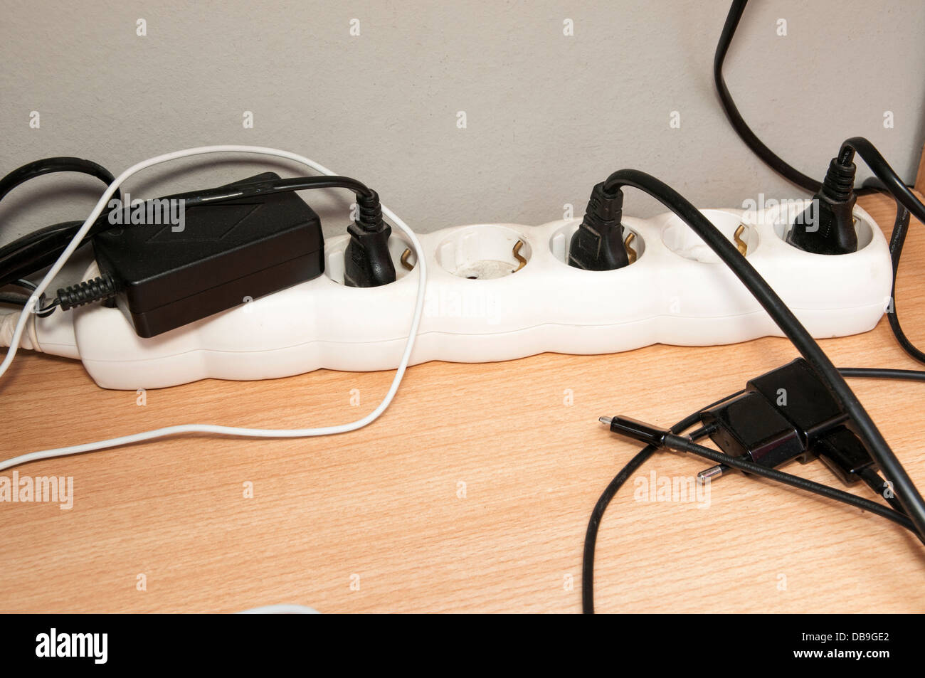 plugged into the wall sockets Stock Photo - Alamy