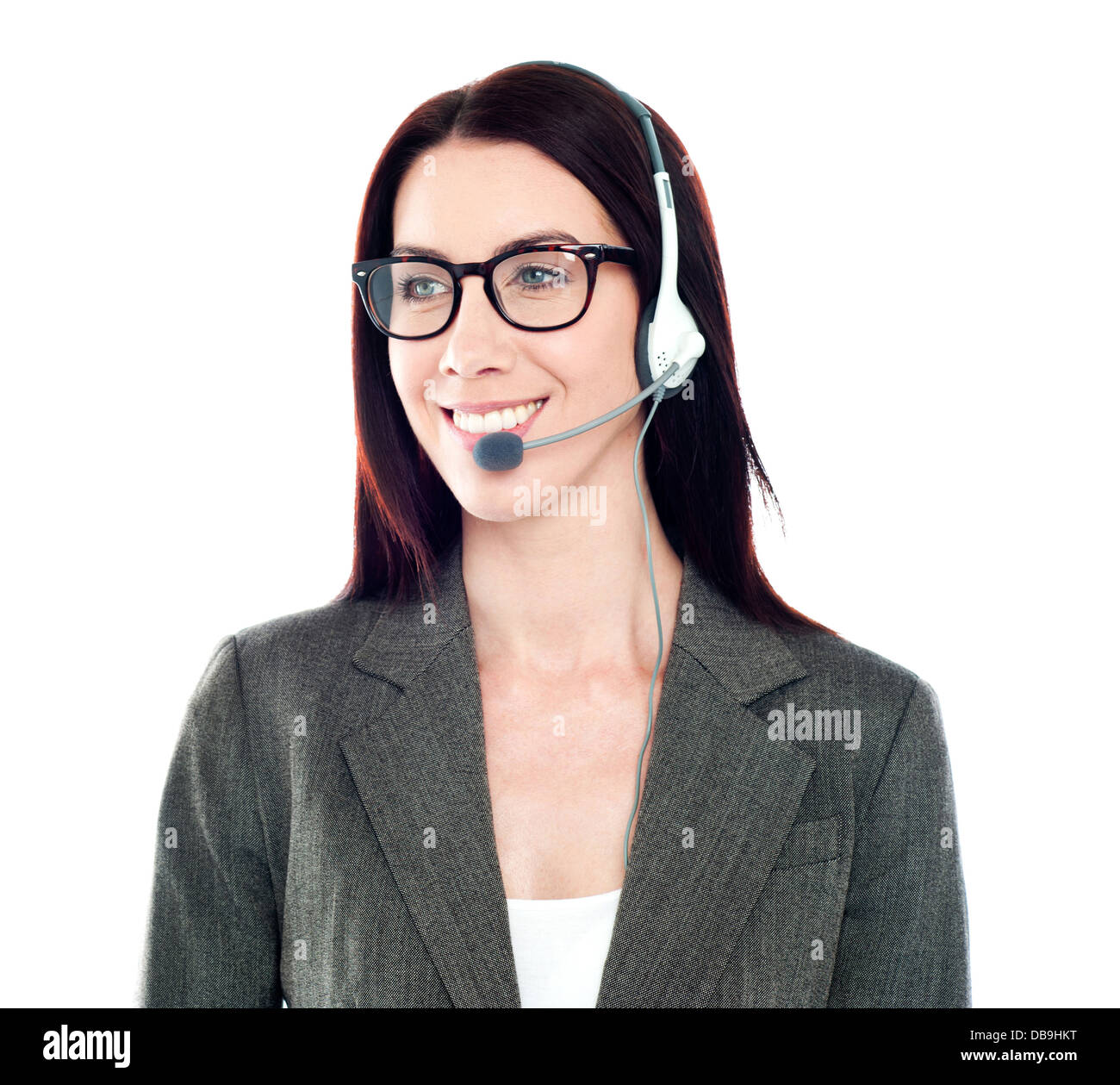 Cheerful female customer care operator looking away Stock Photo - Alamy