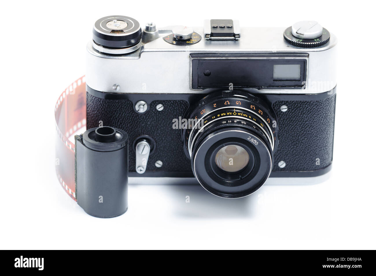 Retro style camera with 35 mm film reel and negative isolated on white ...