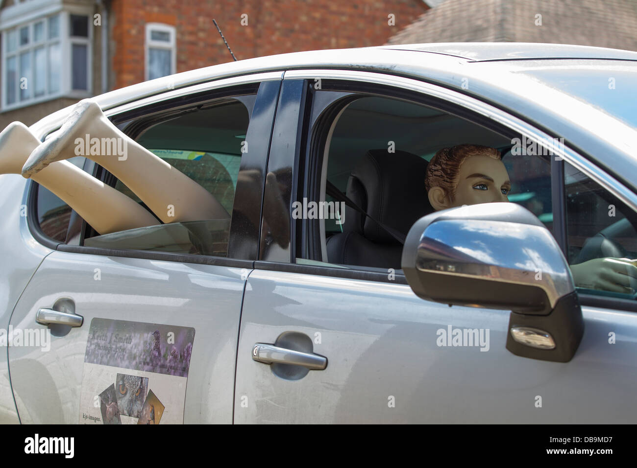 Mannequin in Drivers Seat of a car Stock Photo - Alamy