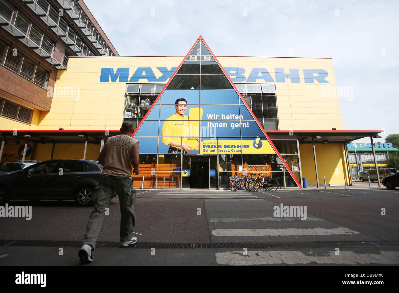 A man walks towards the a Max Bahr hardware store, next to the ...