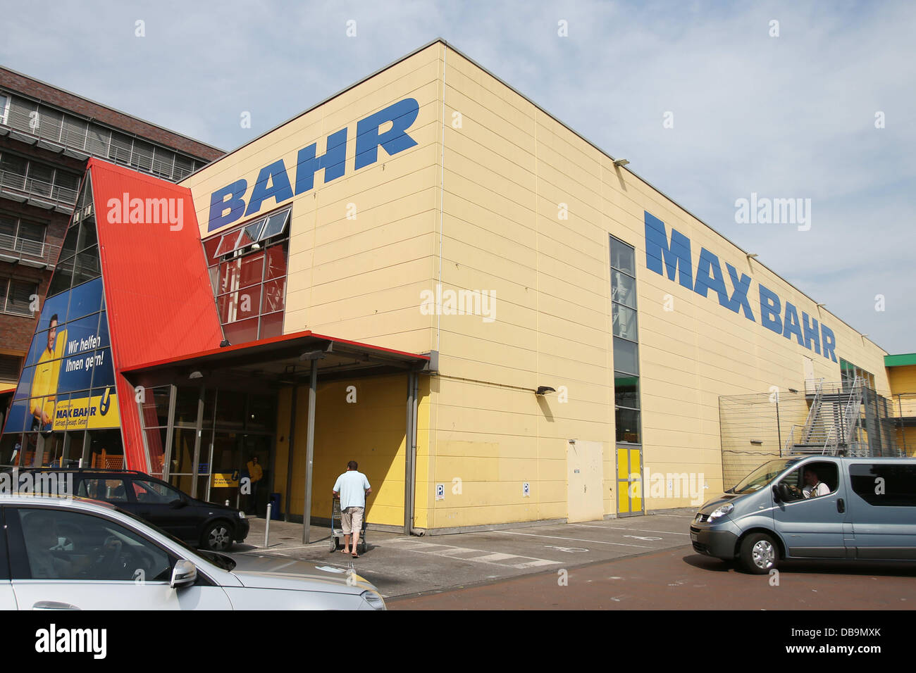 A man walks towards the a Max Bahr hardware store, next to the ...