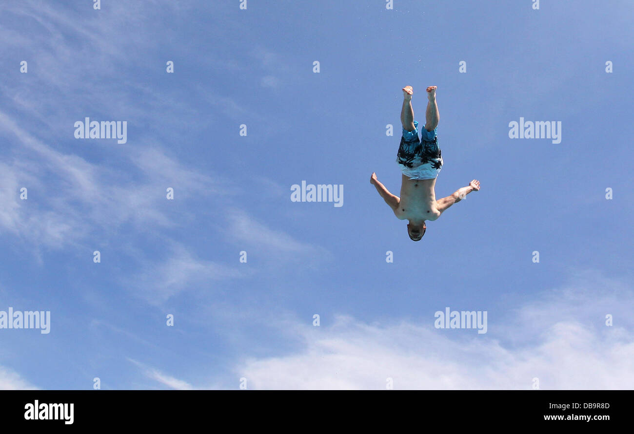A man jumps from the diving tower into the pool in Landsberg am Lech ...