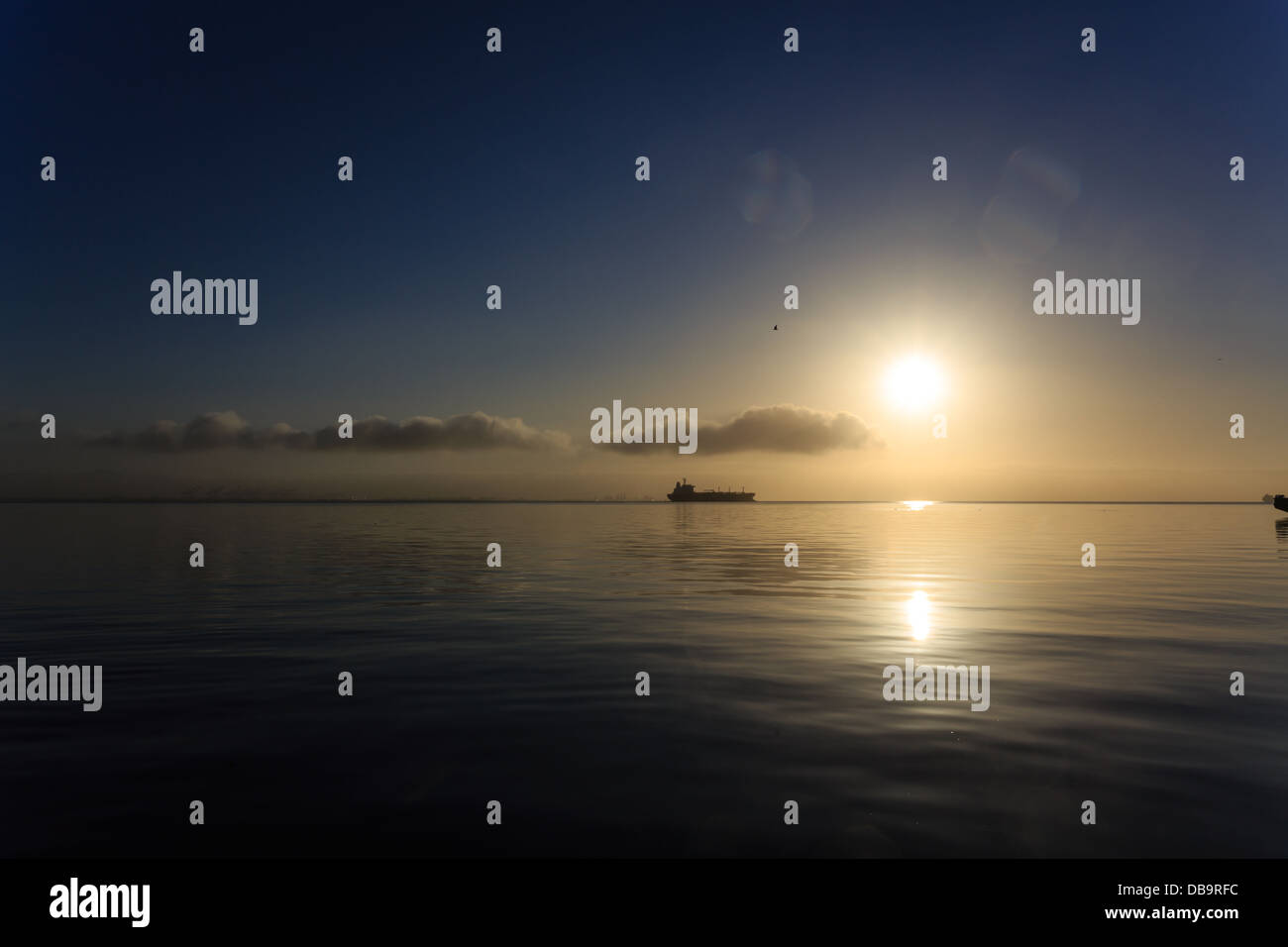 Tanker ship at sunrise Stock Photo - Alamy