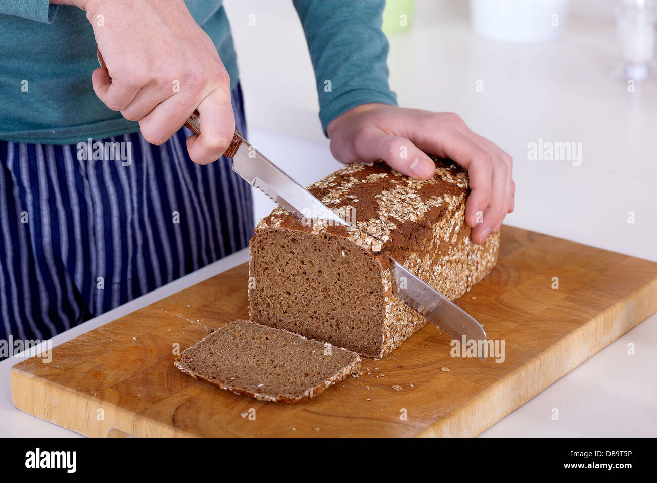 Holding a loaf of bread in his hands hi-res stock photography and ...