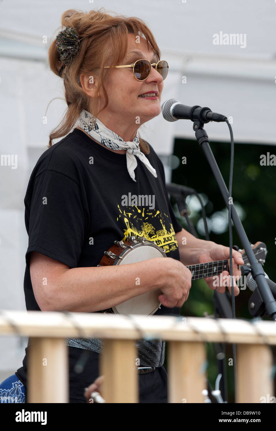 Gabriela La Foley playing a banjo ukulele Stock Photo - Alamy