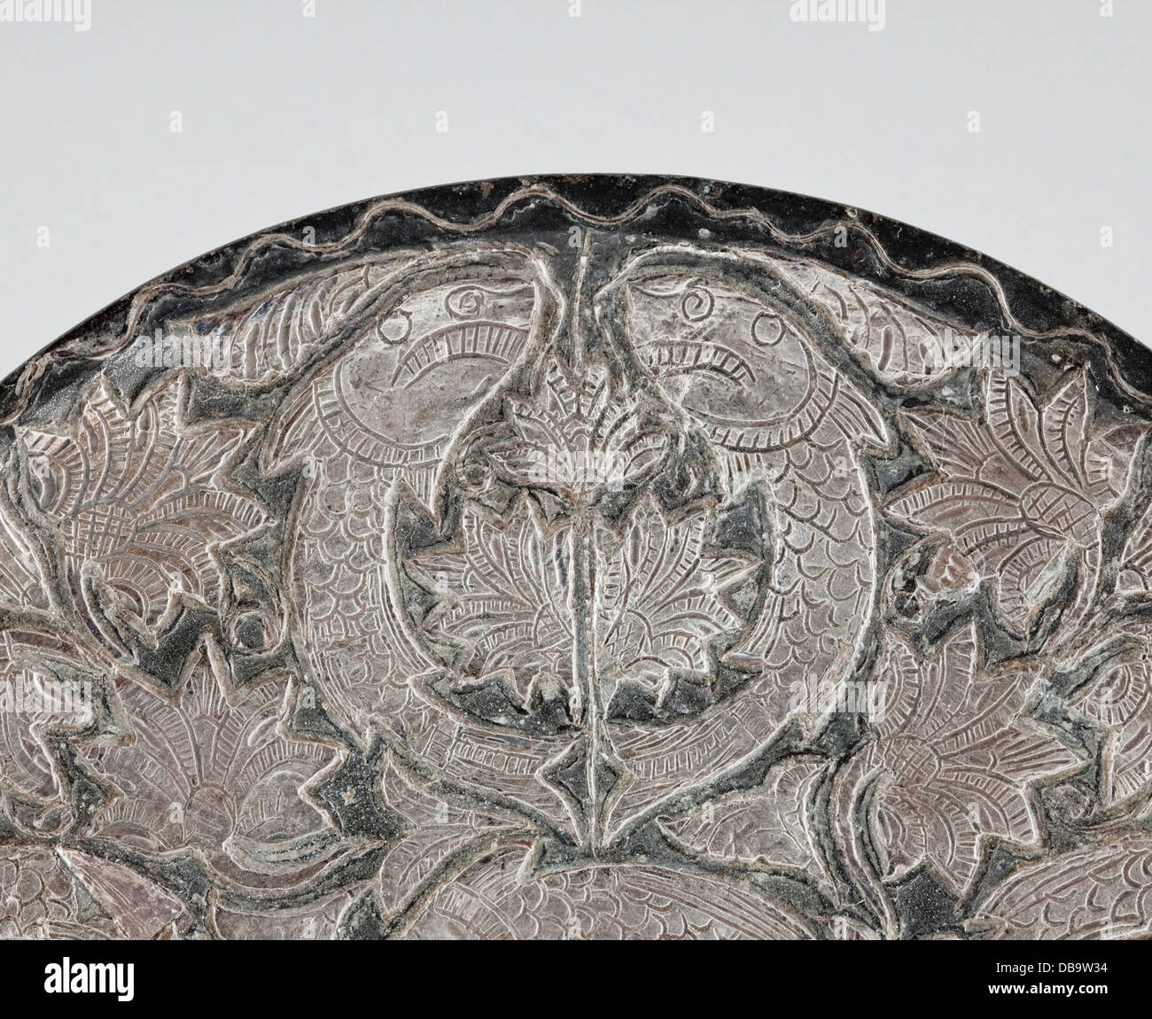 This Persian ceramic plate, decorated with emblematic pairs of fish ...