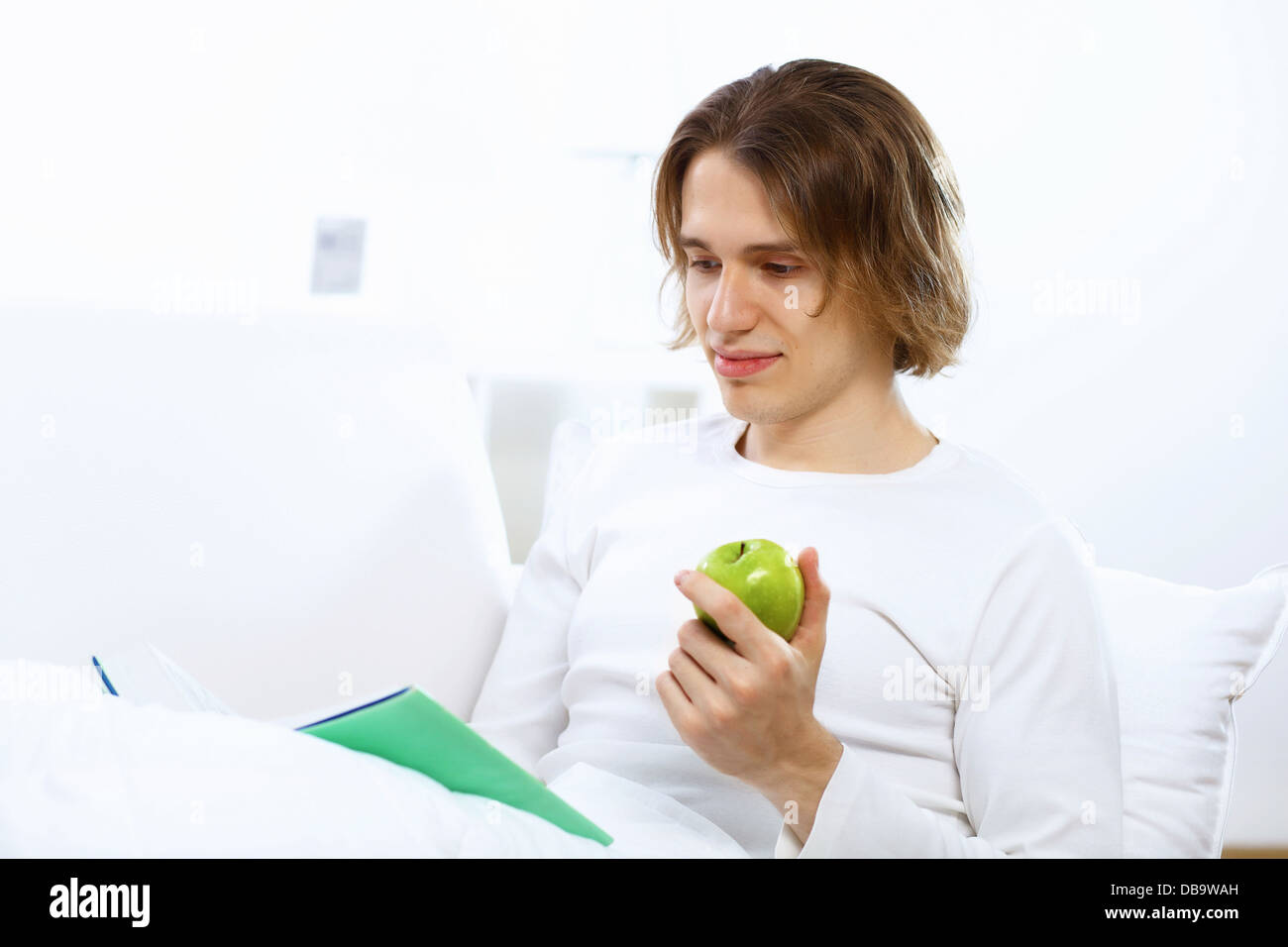 Young man with notebook Stock Photo - Alamy