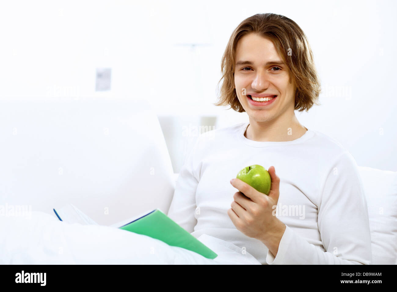 Young man with notebook Stock Photo - Alamy
