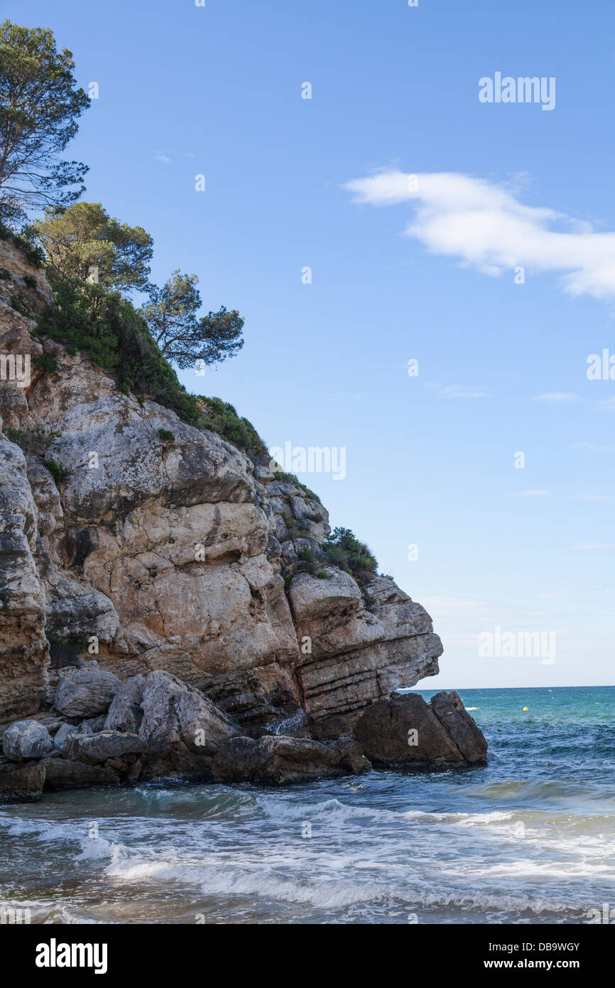 rocky outcrop at beach cove Stock Photo - Alamy