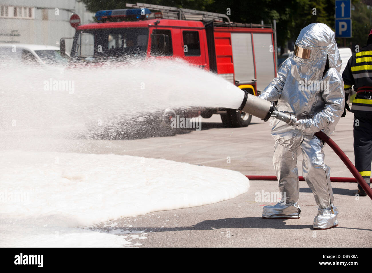 fireman in action Stock Photo - Alamy