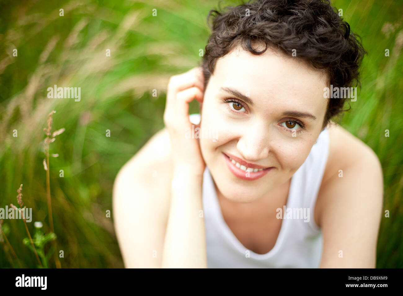 happy cute girl on green field Stock Photo - Alamy