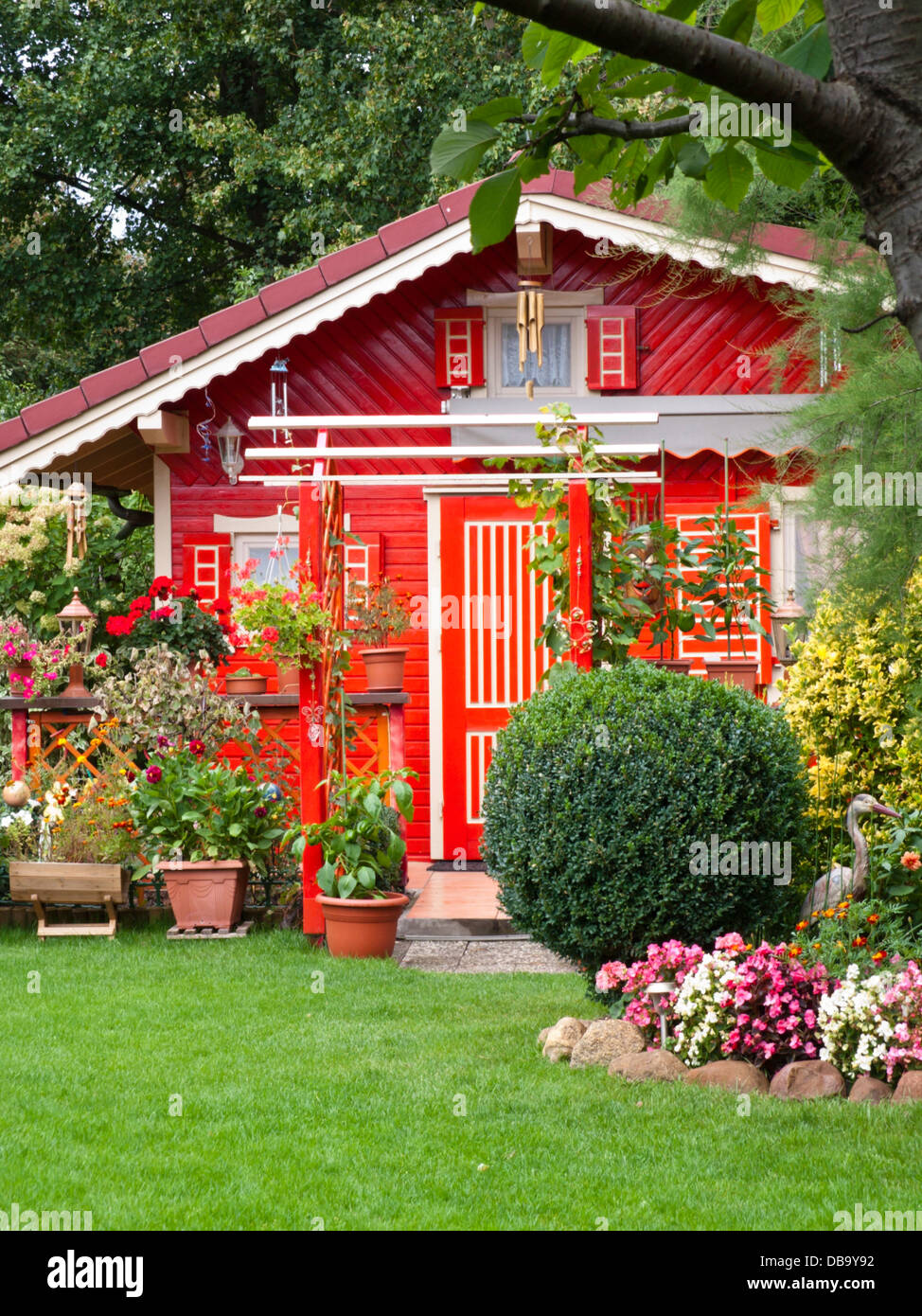 Red garden house Stock Photo - Alamy