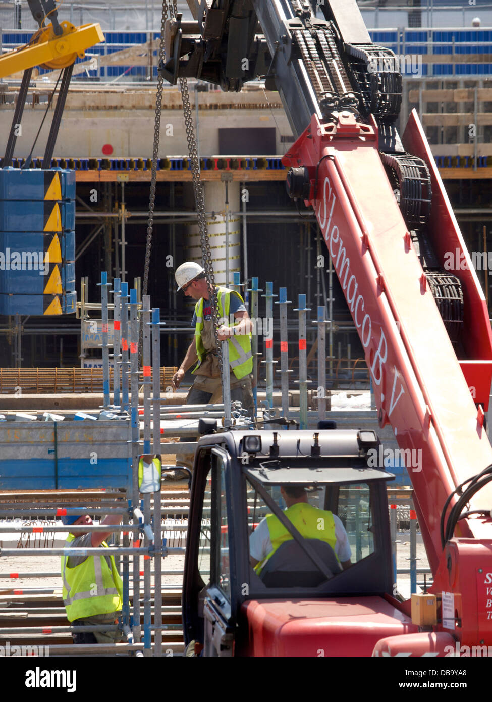 Construction workers using crane hi-res stock photography and images ...