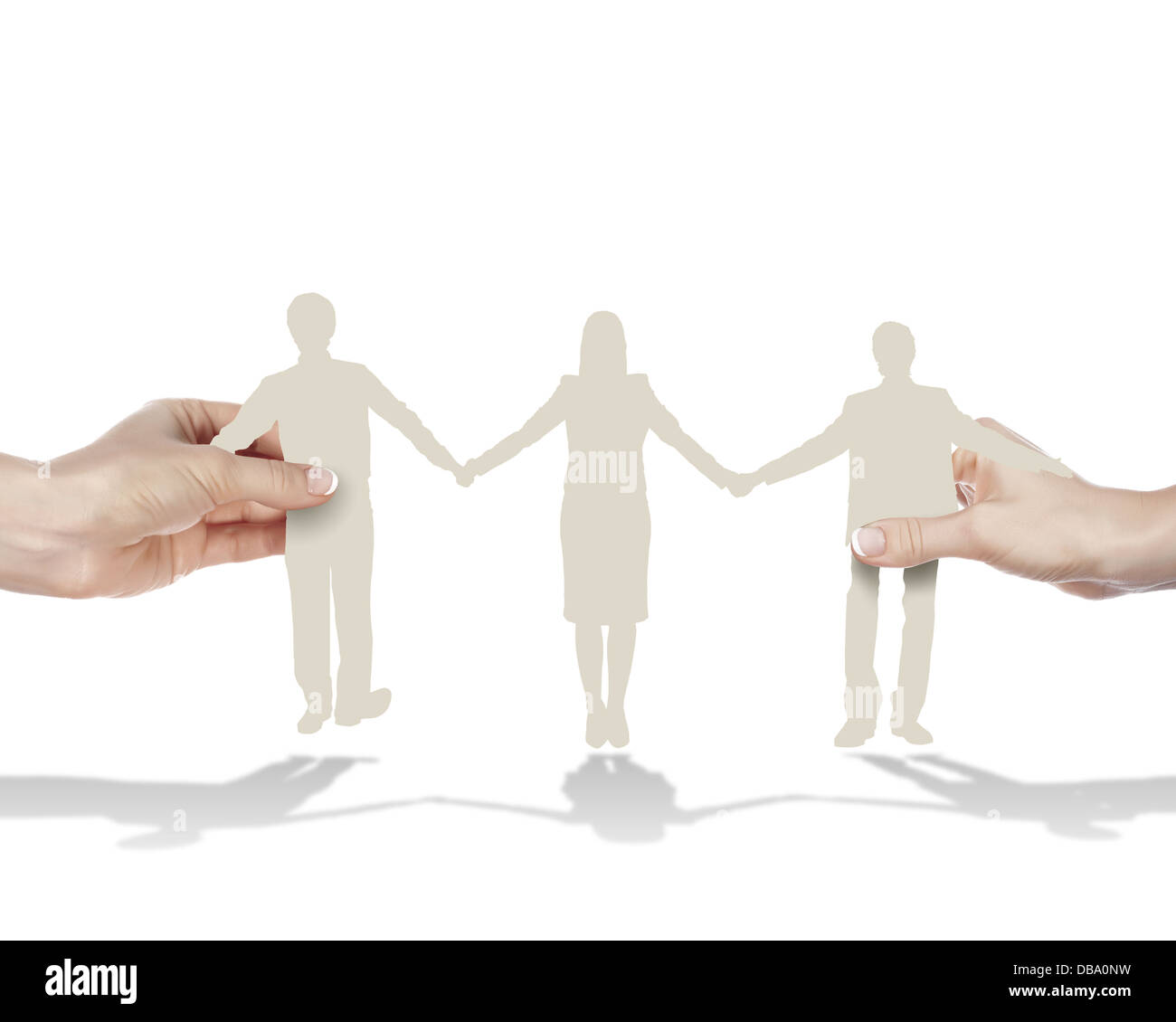 Three people standing and holding hands Stock Photo - Alamy