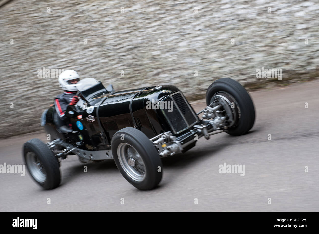 Chichester, UK - July 2013: Era D-Type R4D passes the flint wall in ...