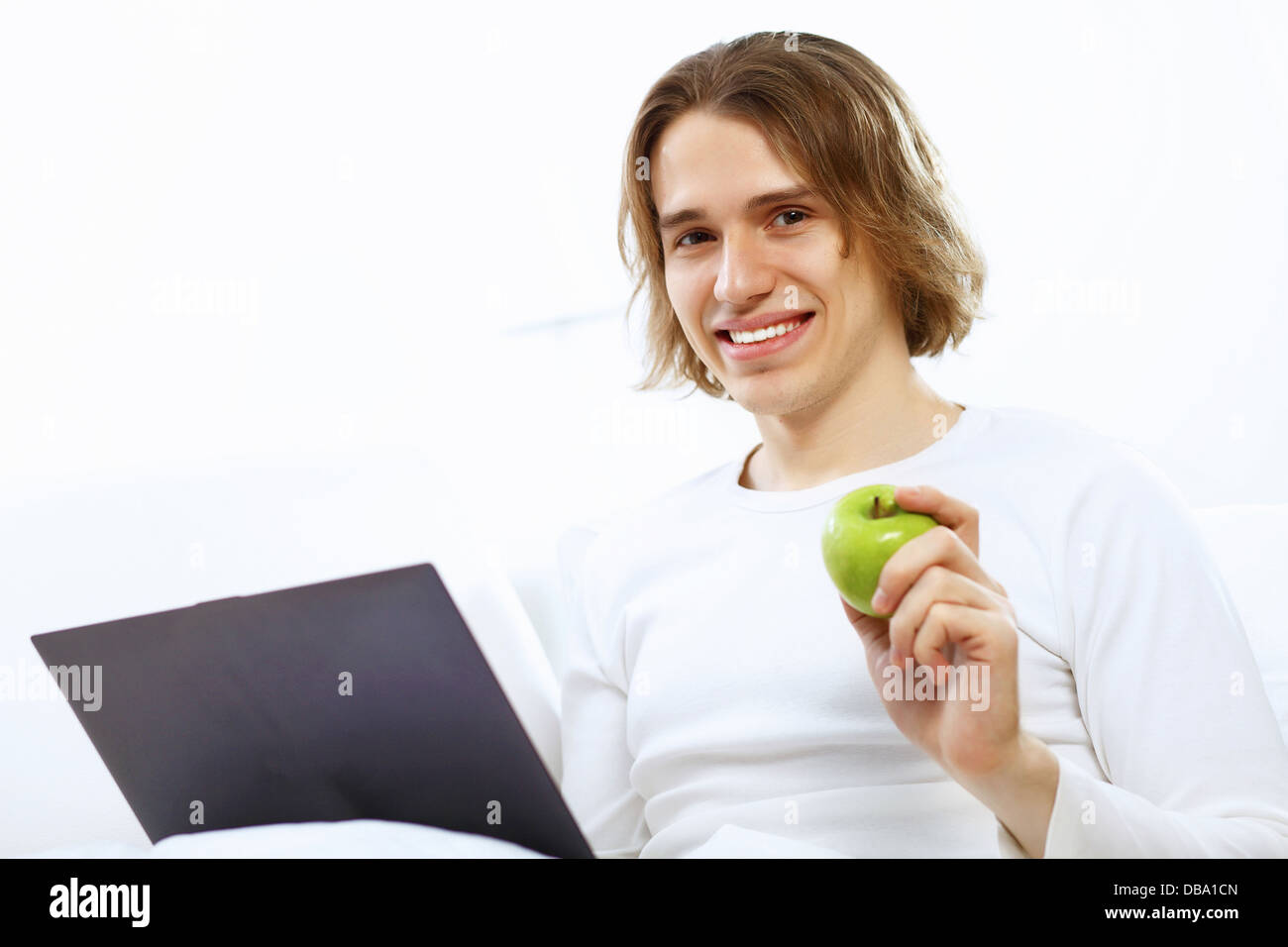 Young man with notebook Stock Photo - Alamy