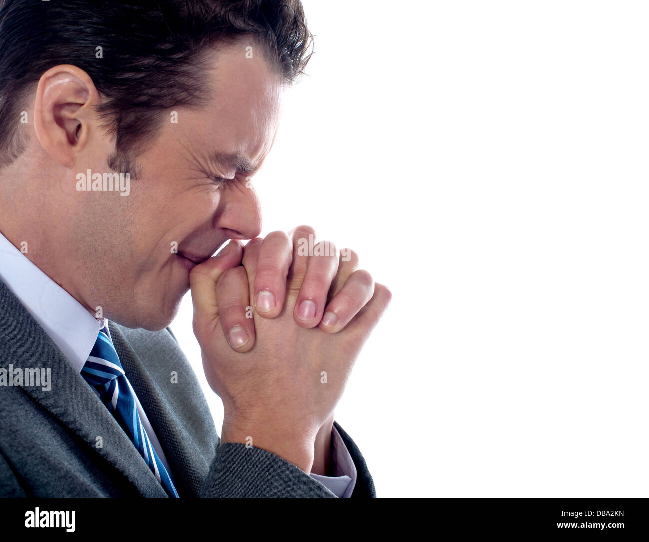 Business executive praying to god Stock Photo - Alamy