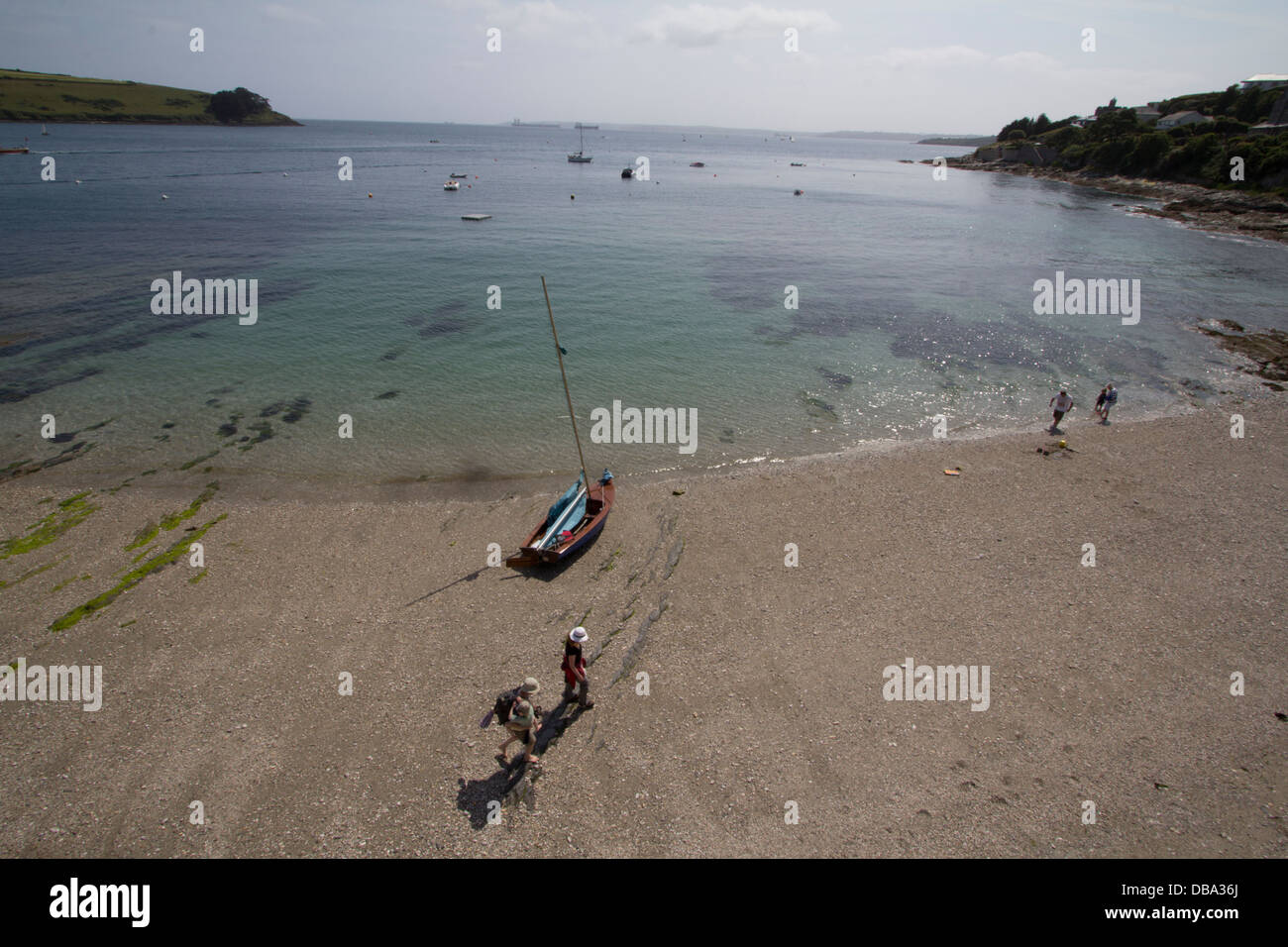 Tourists enjoy the scenic coastal views and calm waters at St Mawes ...