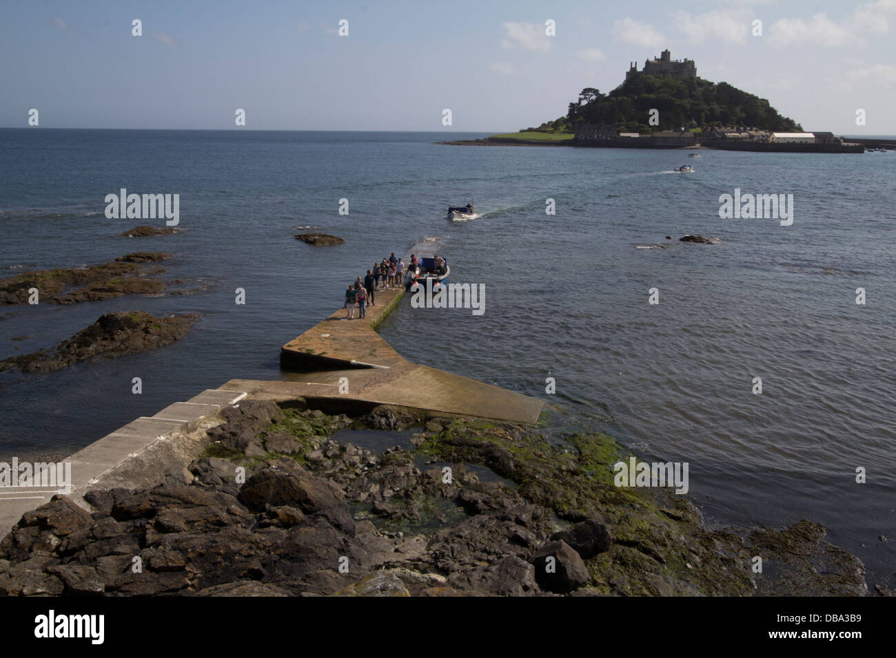 Tourists arrive at the mainland jetty after a boat trip from Saint ...