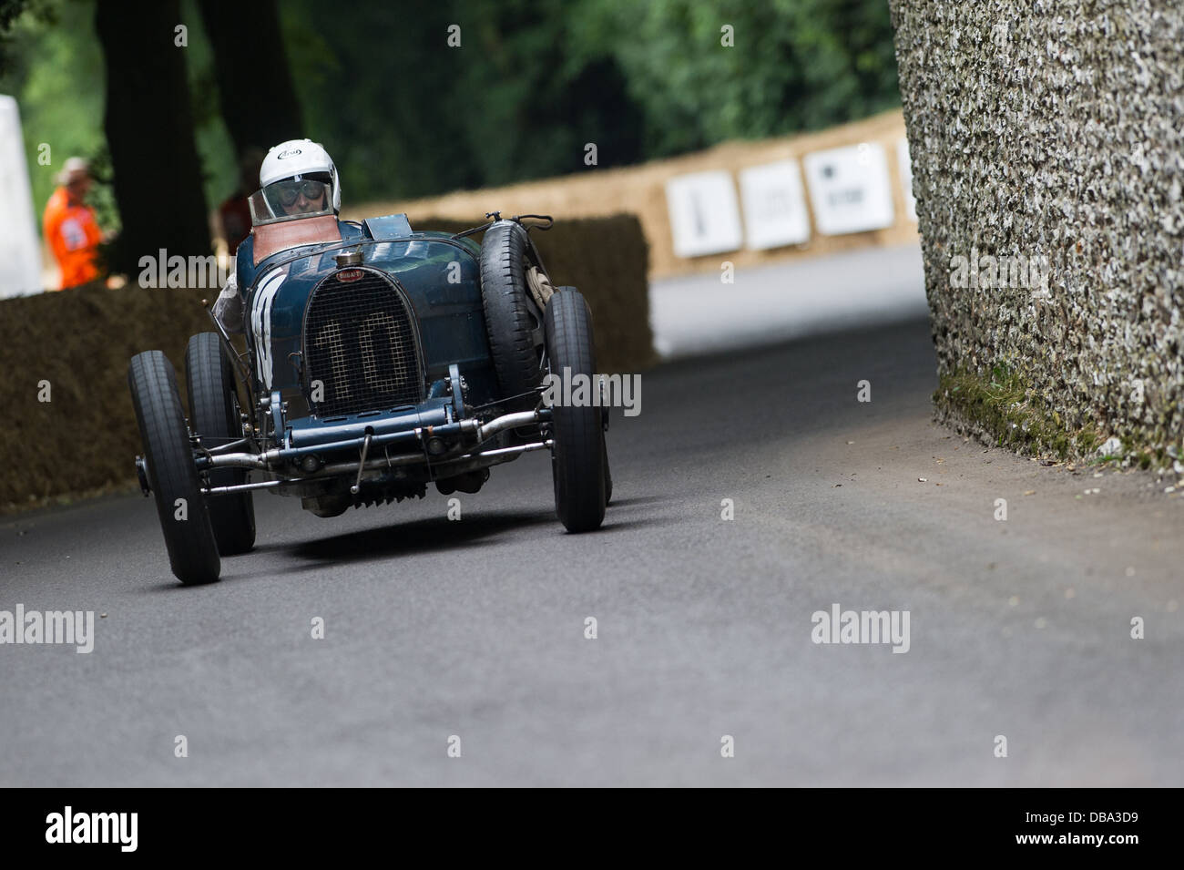 Chichester, UK - July 2013: Bugatti Type 35C passes the flint wall in ...