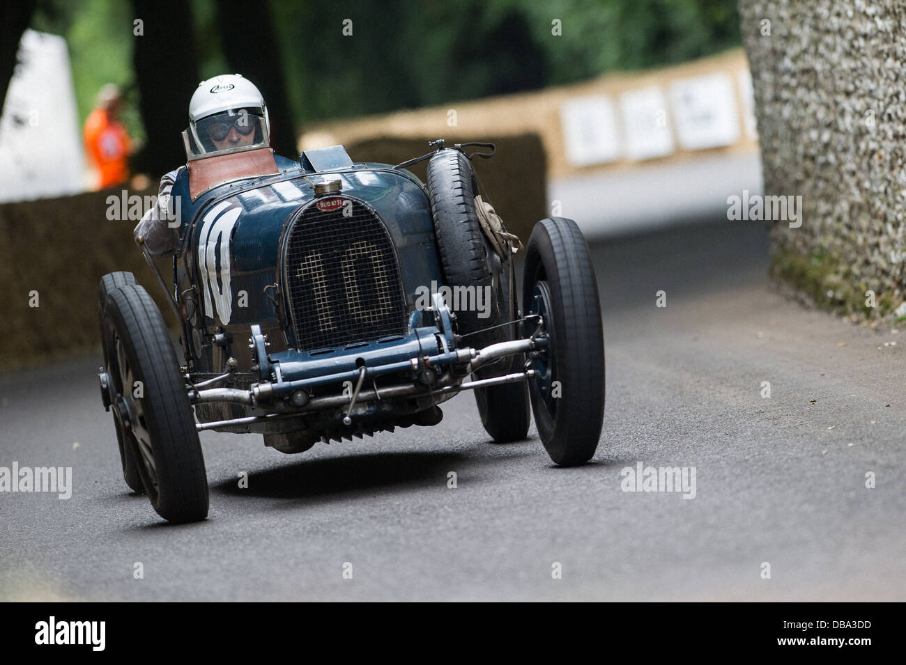 Chichester, UK - July 2013: Bugatti Type 35C passes the flint wall in ...